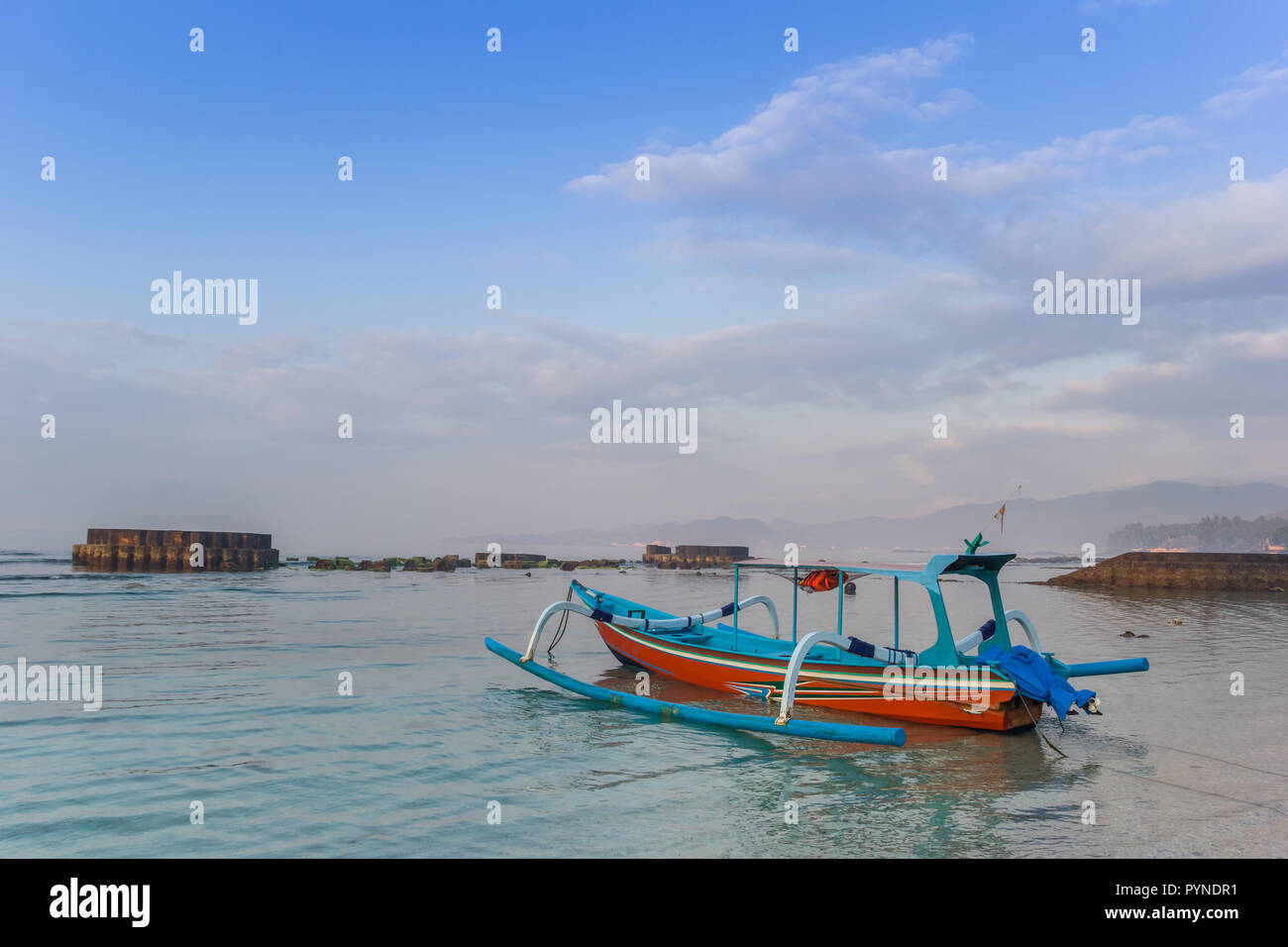 Traditional indonesian fishing boat at the Candidasa coast of Bali ...