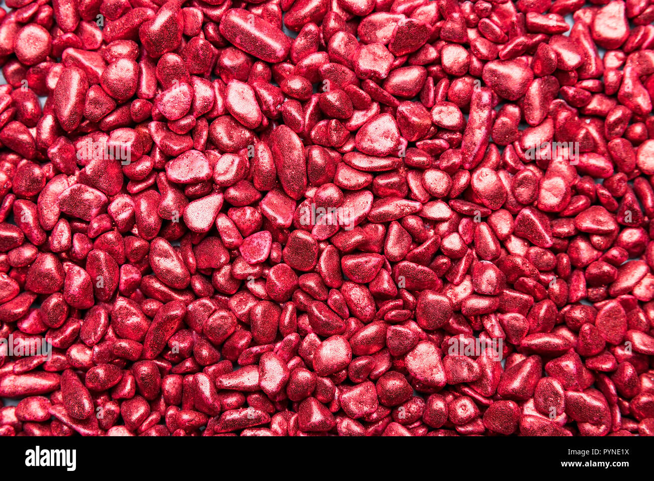 Red colored stones as a background for Valentine's Day Stock Photo - Alamy