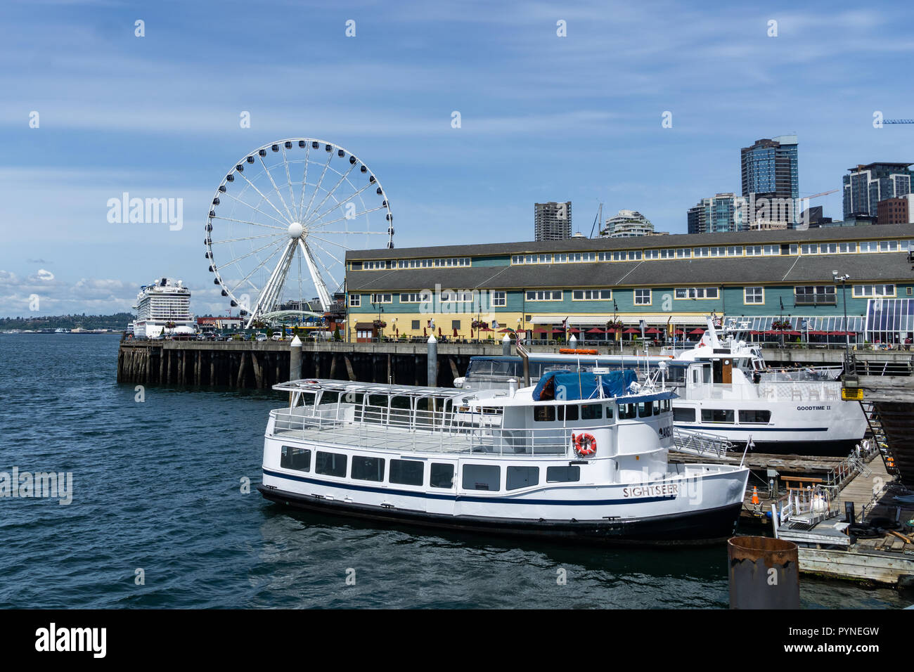 Seattle waterfront and Ferris Wheel, with pier and boat, Elliott Bay ...