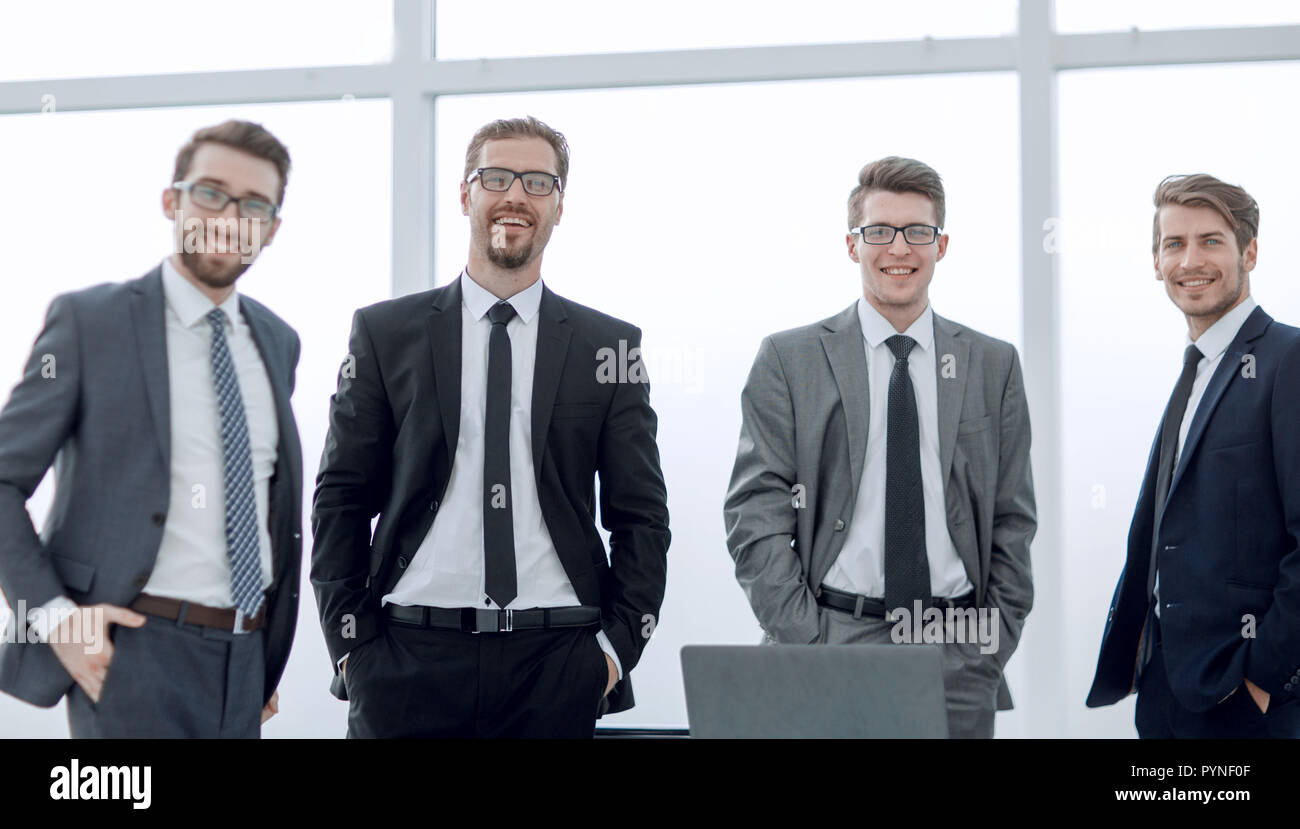 professional business team standing in the office Stock Photo - Alamy
