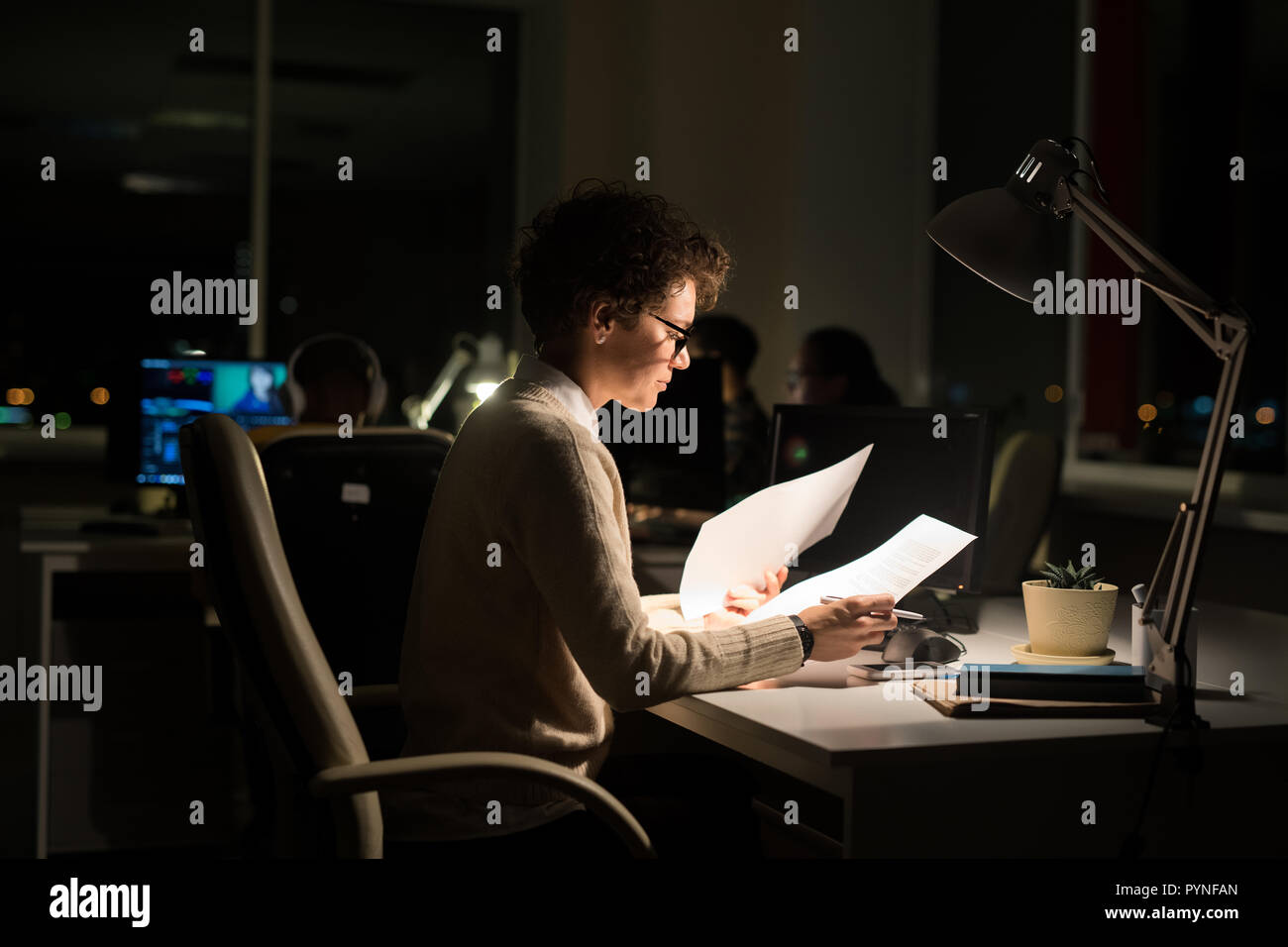 Woman office night hi-res stock photography and images - Alamy