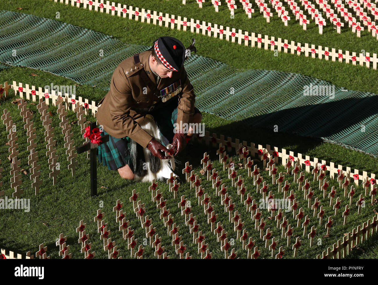 Captain Gary Rattray from 2 Scots Royal Regiment of Scotland lays a ...