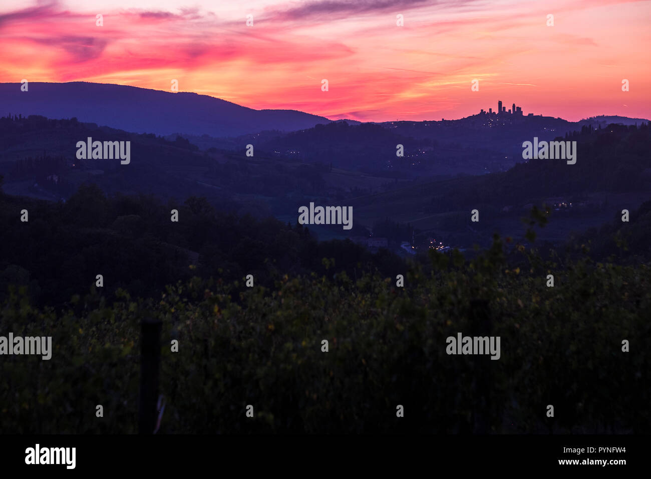 Amazing coloured sunset in Tuscany Italy with red clouds and blue ...