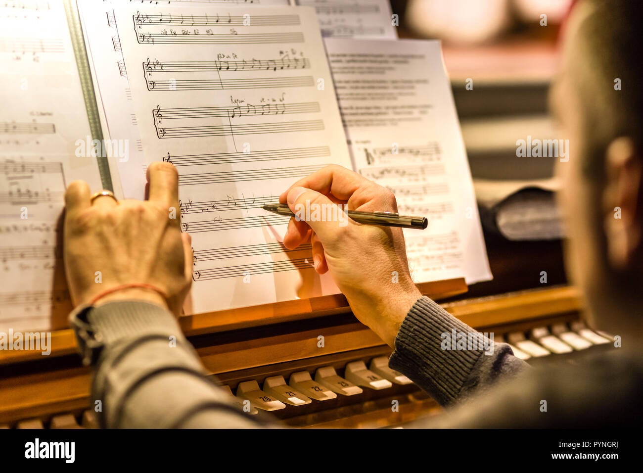 male hand writing music on white music sheet Stock Photo - Alamy