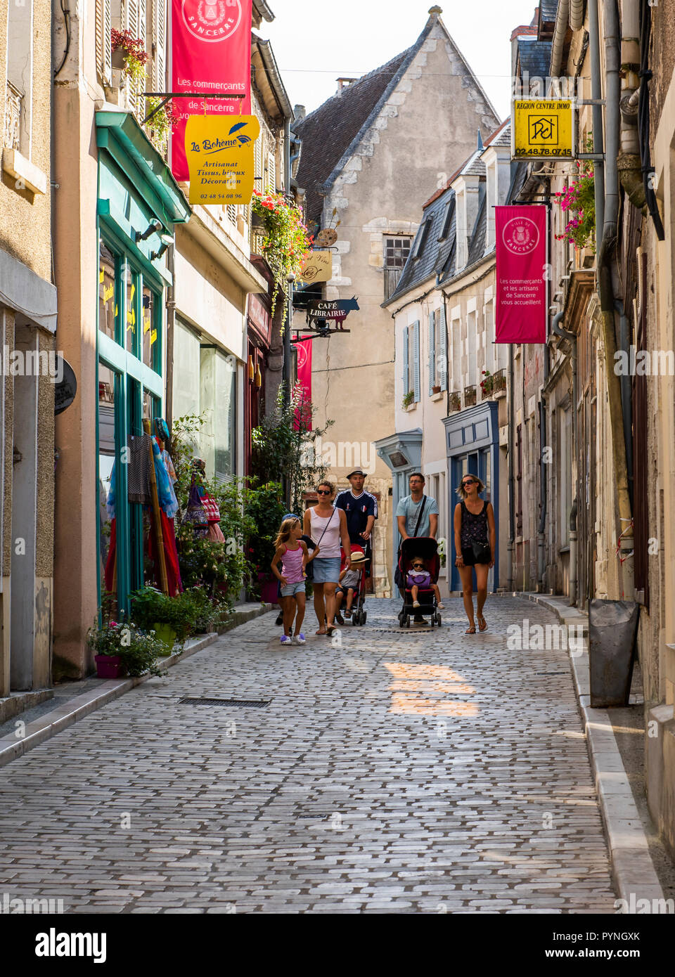 Sancerre, France - August 8, 2018: Tourists in narrow street with old ...
