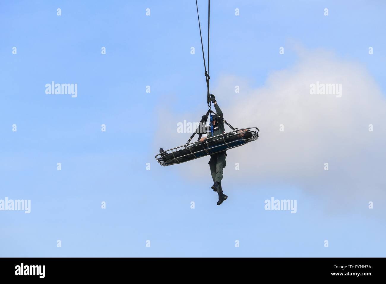 Soldier rescue emergency by army helicopter with rope on blue sky Stock ...