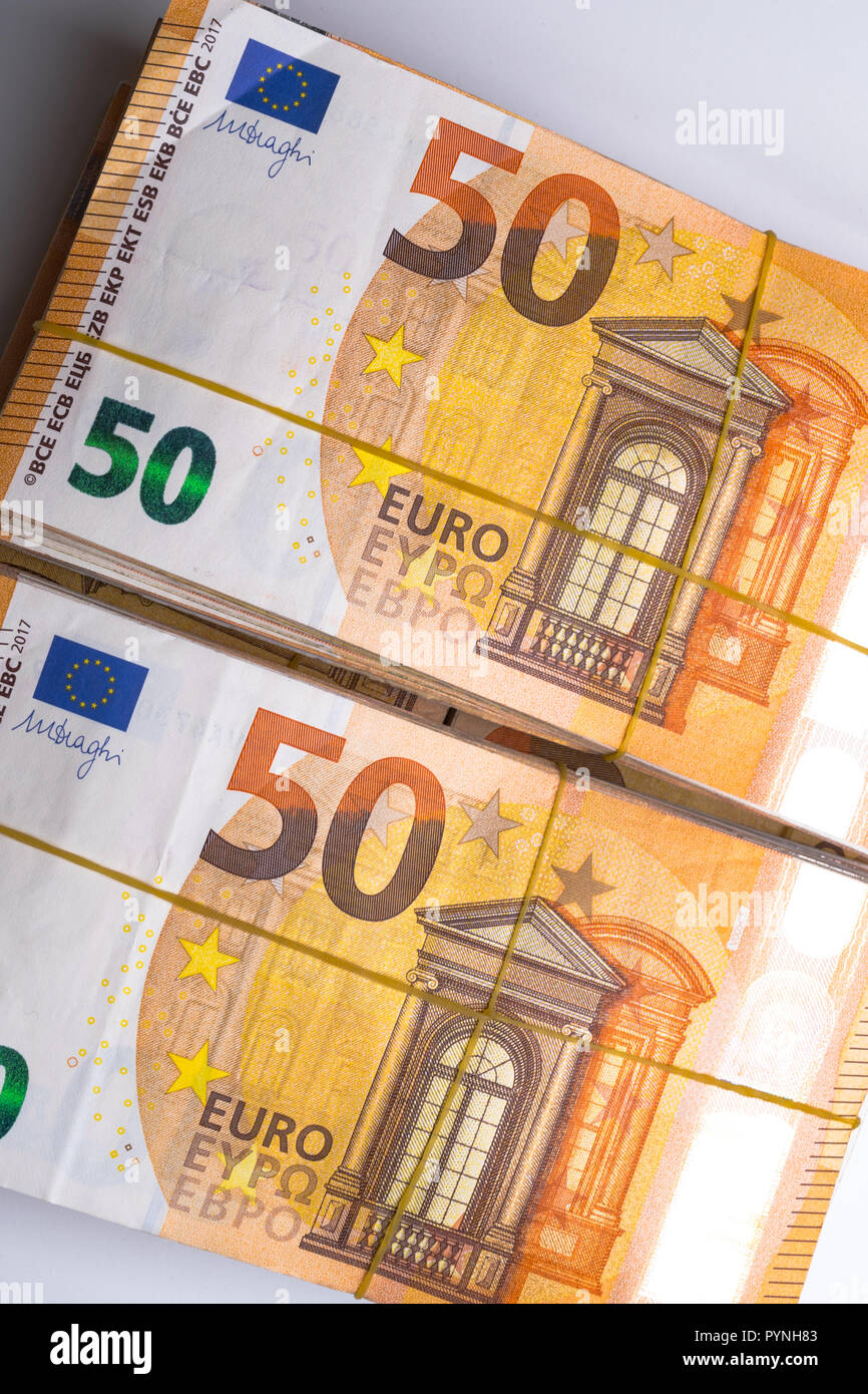 Pile of 50 real euro notes 50-euro banknotes under rubber band ...