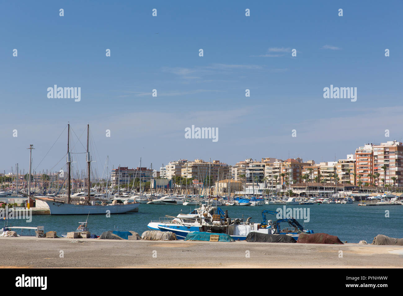 Torrevieja Spain port and marina with boats and ships and blue sea and ...