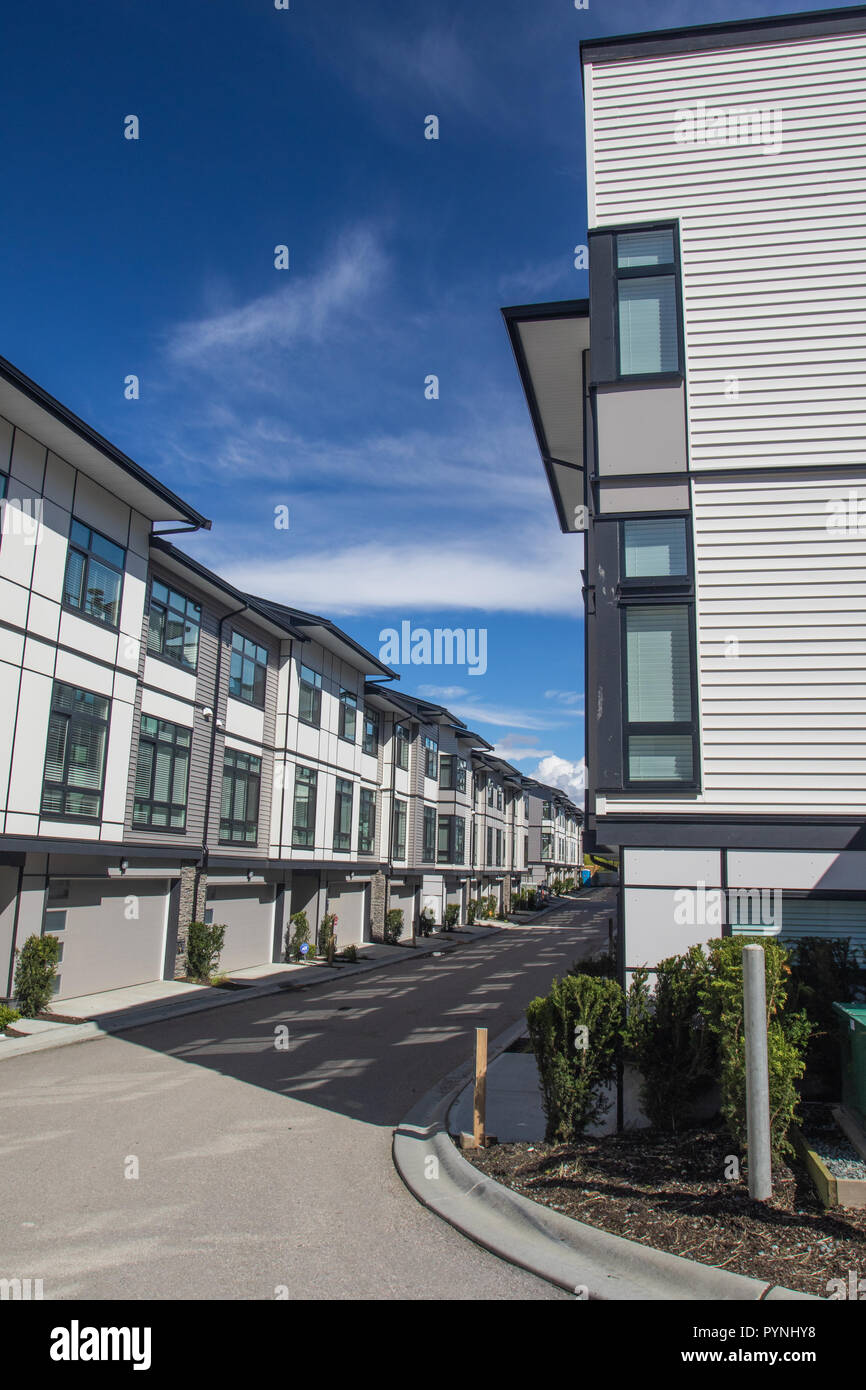 Nice development of new townhouses. External facade of a row of ...