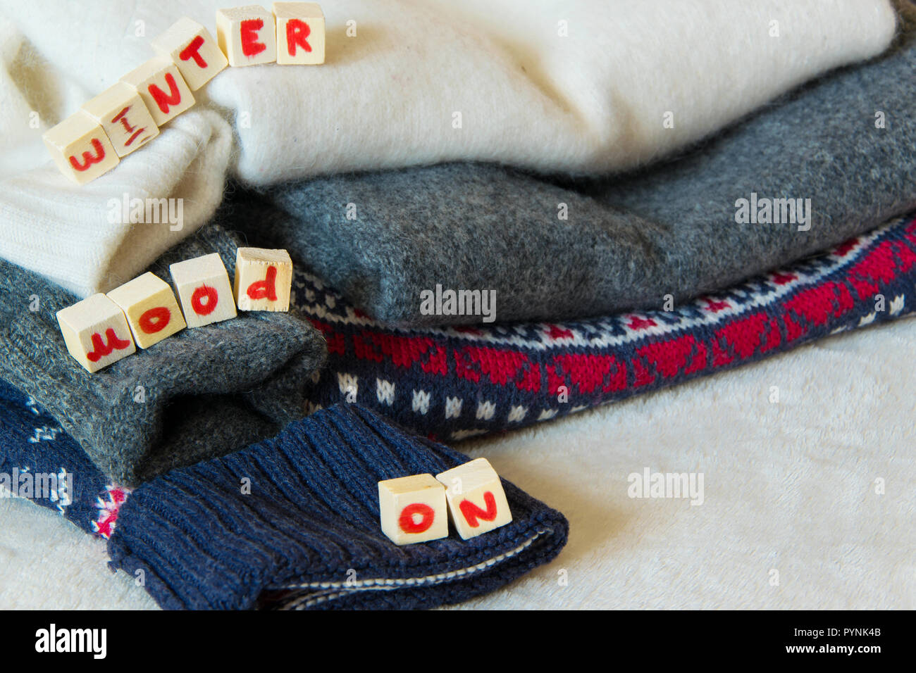Crop view of woolen sweaters with "Winter mood ON" text, fashion ...