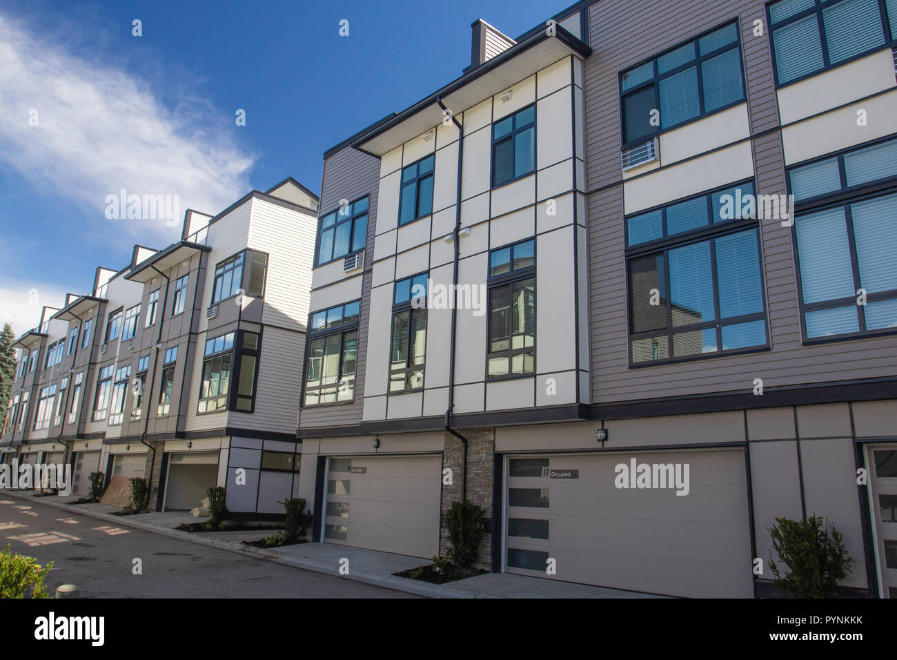 Brand new townhouse complex. Rows of townhomes side by side. External ...