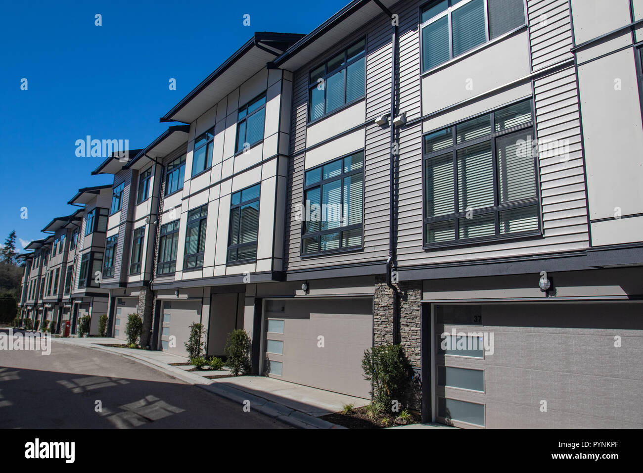 Brand new townhouse complex. Rows of townhomes side by side. External ...