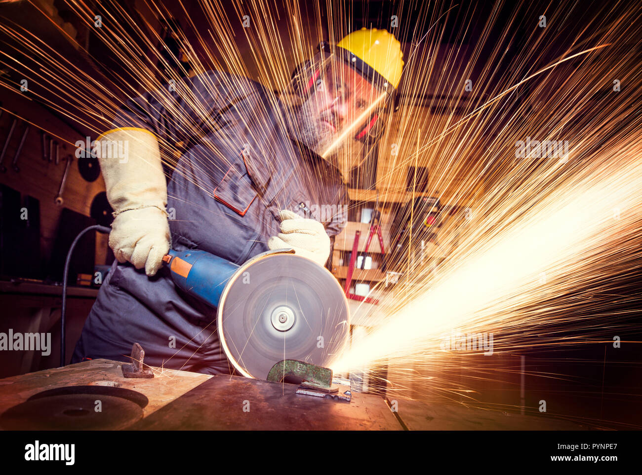 portrait of craftsman work with grinder Stock Photo - Alamy