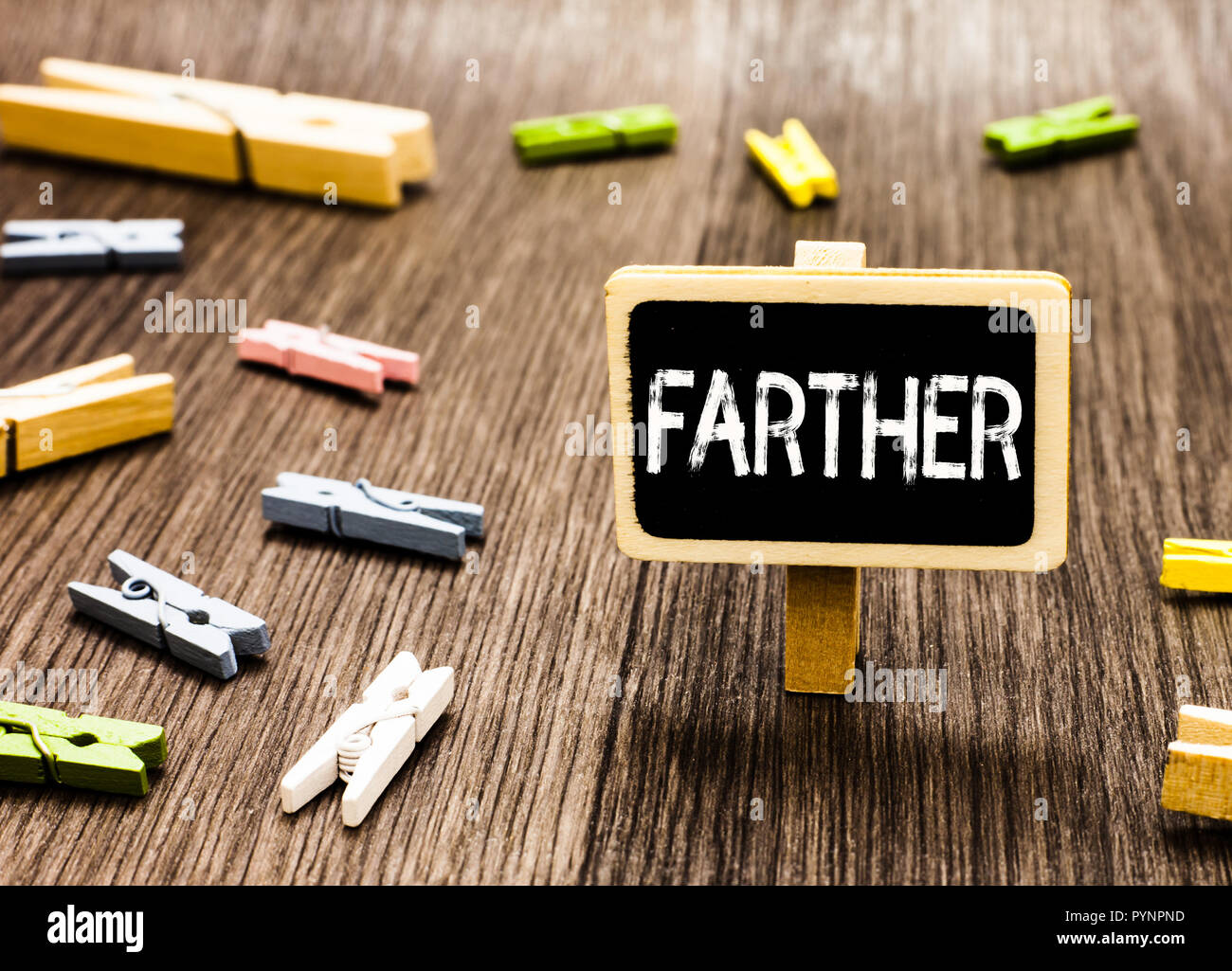 Handwriting text writing Farther. Concept meaning Greater distance More ...