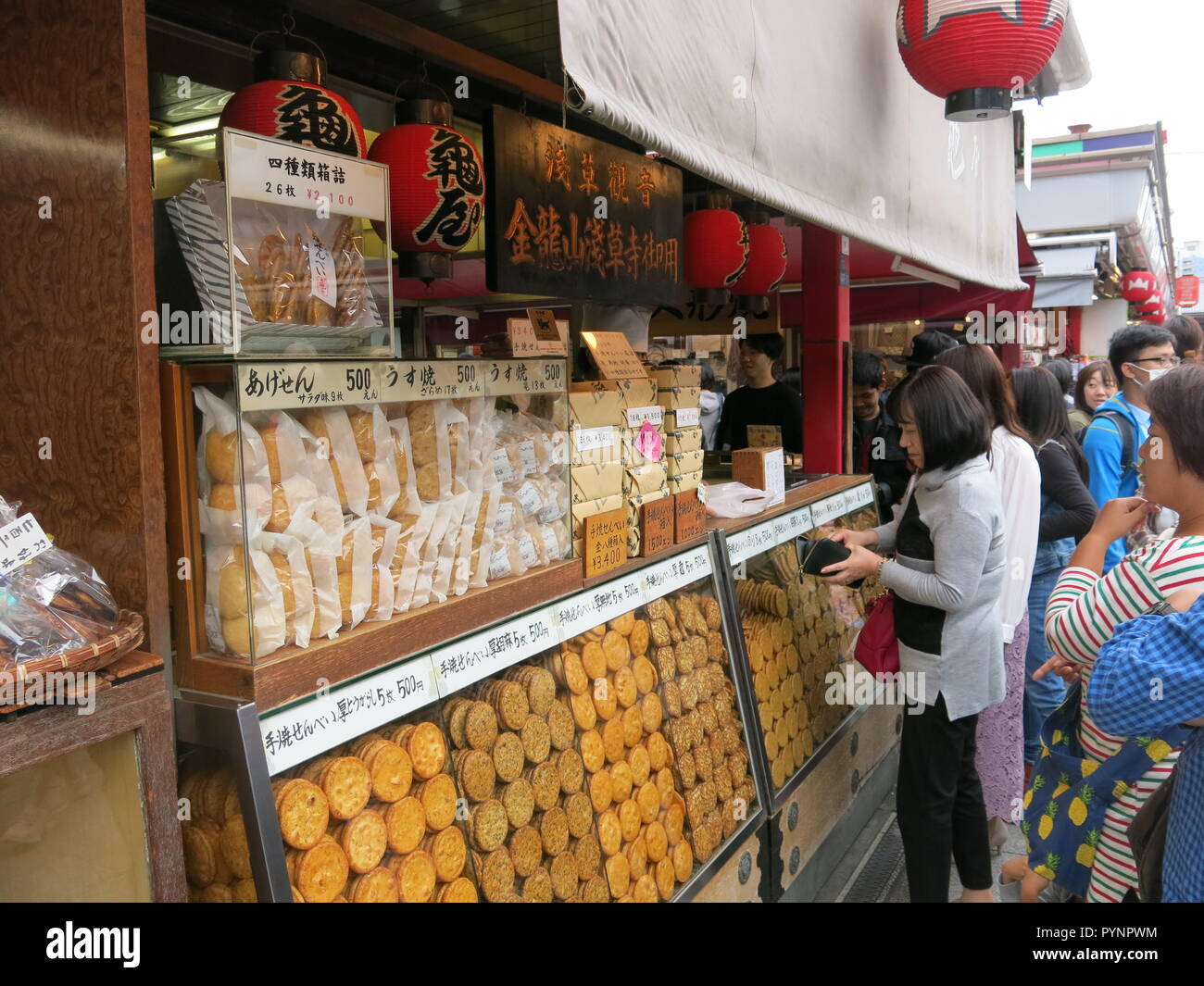 Typical view of a shop counter selling Japanese foodstuffs in a street ...