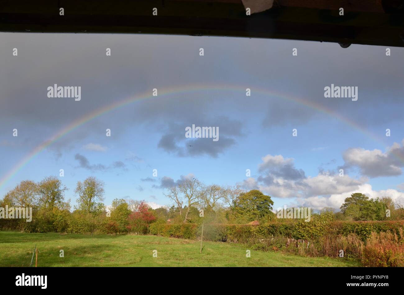 Full complete rainbow over field, Lincolnshire, England, UK Stock Photo ...