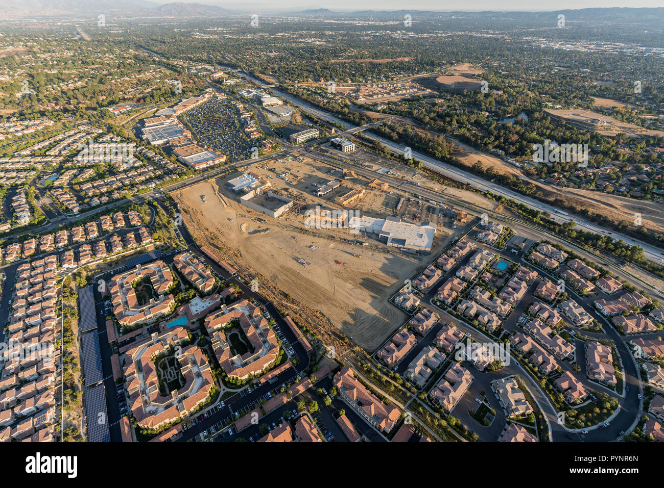 Aerial view of new homes, shopping center construction, Rinaldi Street ...