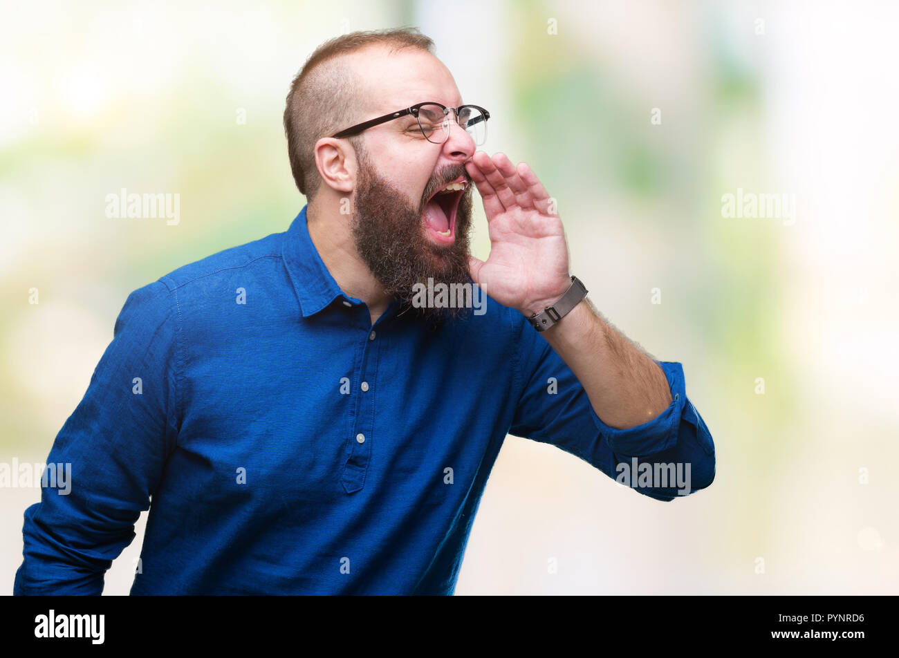 Young caucasian hipster man wearing glasses over isolated background ...