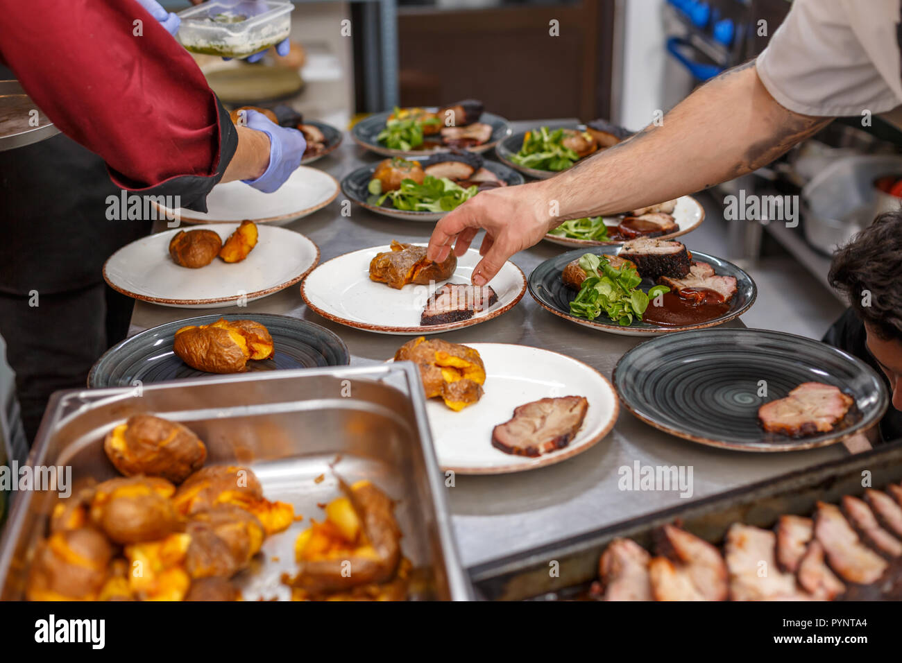 Chef in professional kitchen cooks hi-res stock photography and images ...