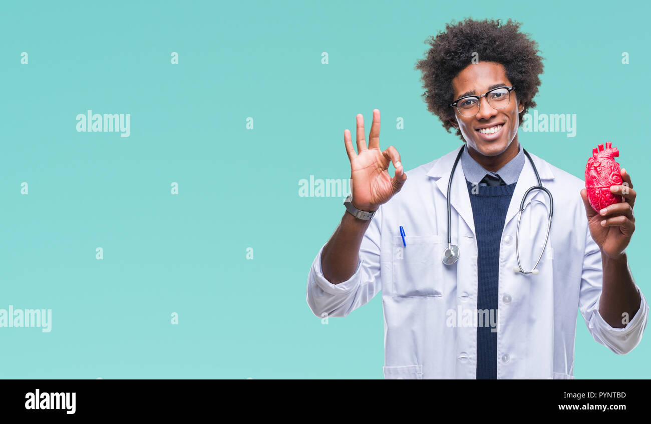 Afro american cardiologist doctor man over isolated background doing ok ...