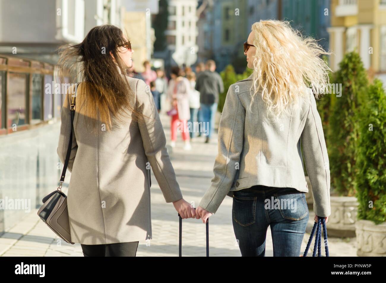 Back view two women outside walking hi-res stock photography and images ...