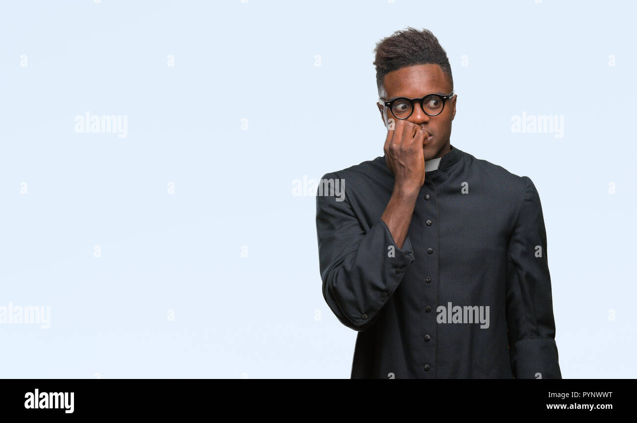 Young african american priest man over isolated background looking ...