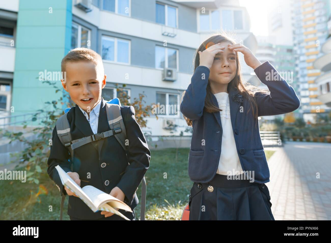 Outdoor portrait of smiling schoolchildren in elementary school. A ...