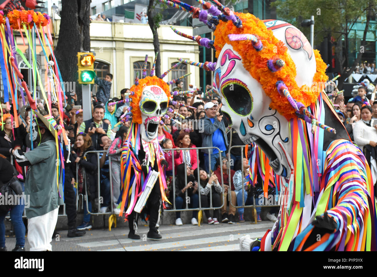 Participants seen dressed as the dead during the parade. People take ...
