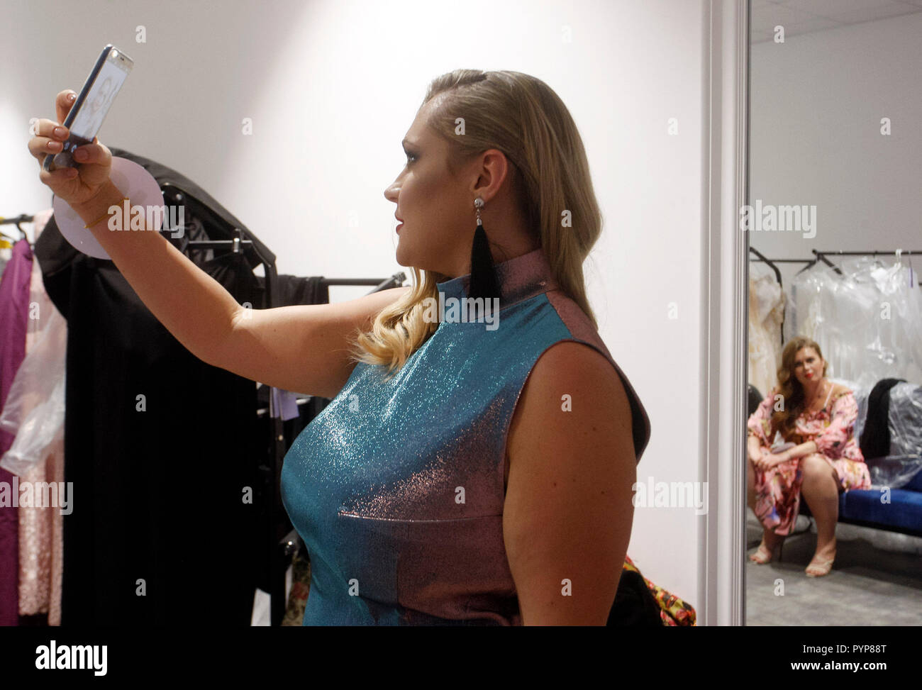 A contestant seen taking a selfie photo backstage during the "Miss ...