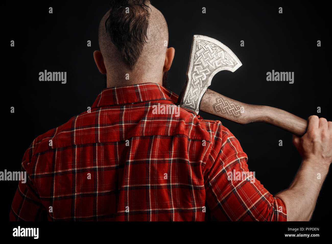 rear view of bearded man with axe on shoulder in studio Stock Photo - Alamy