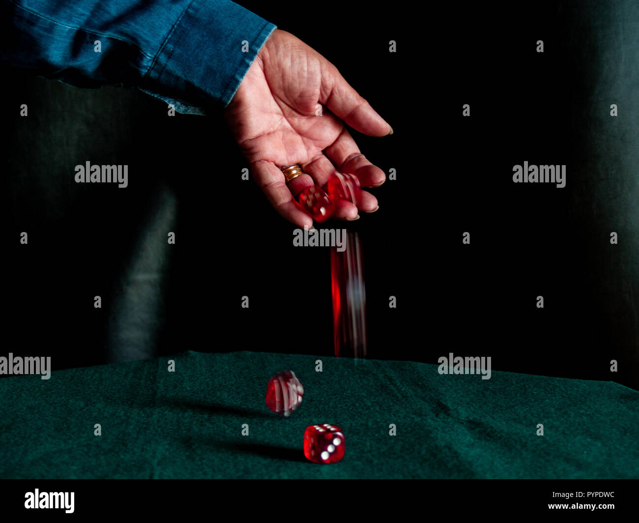 Hand throwing dice hi-res stock photography and images - Alamy