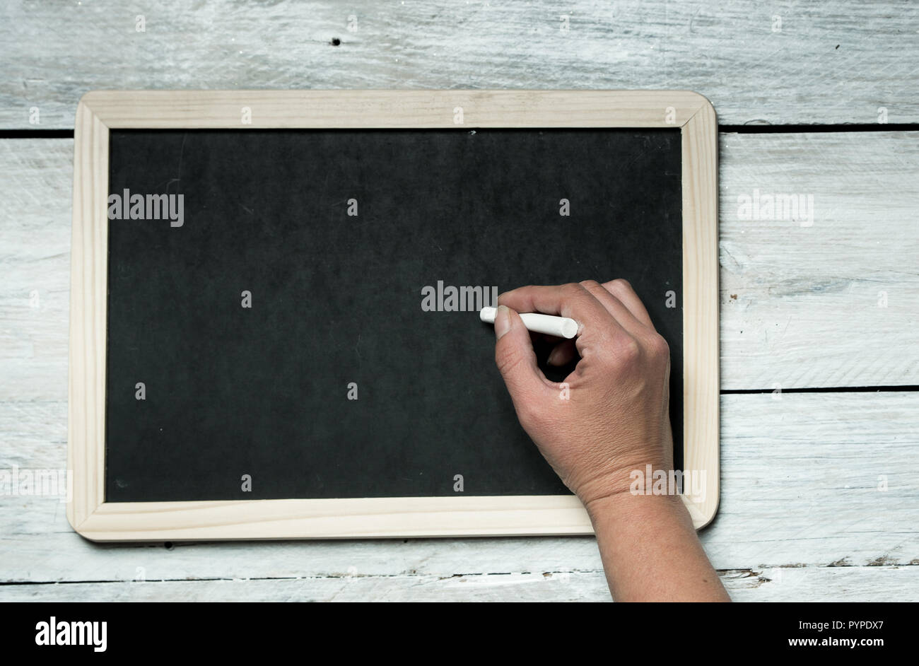 Hand showing on chalkboard hi-res stock photography and images - Alamy
