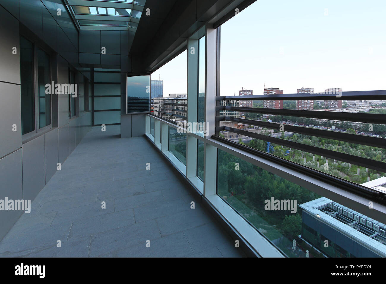 Long terrace with sky window in penthouse apartment Stock Photo - Alamy