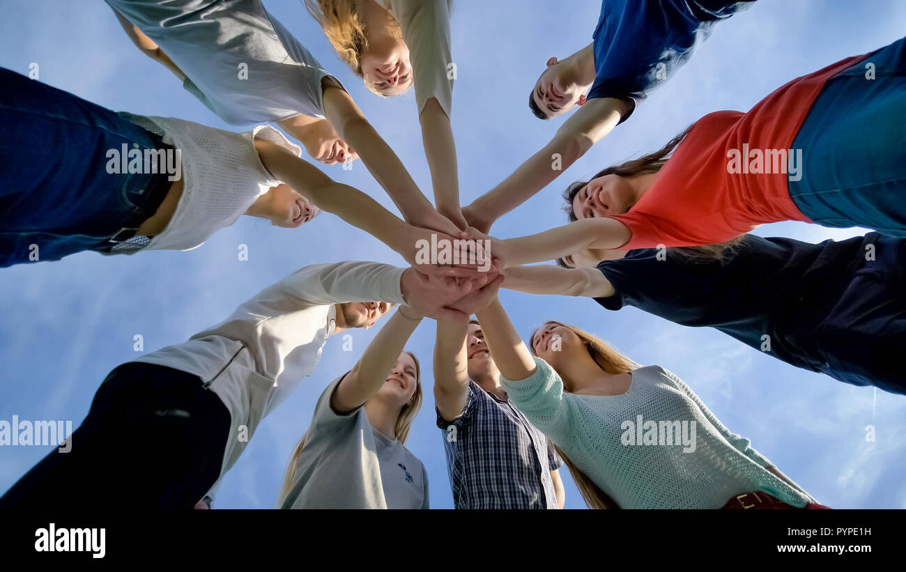 Close-up join hands group meeting, young people teamwork concept Stock ...
