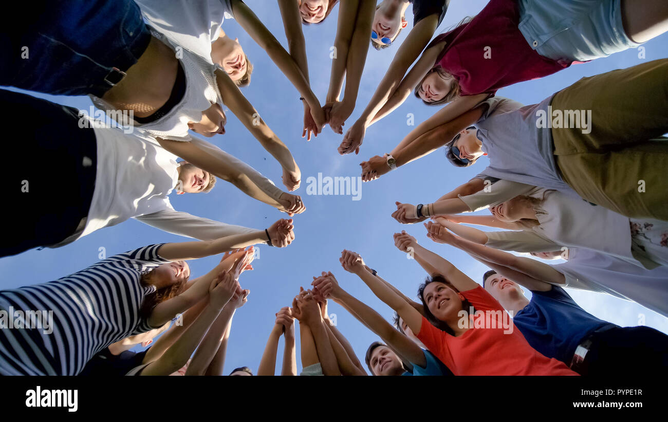 College Students Teamwork Stacking Hand Concept. Nineteen friends Stock ...