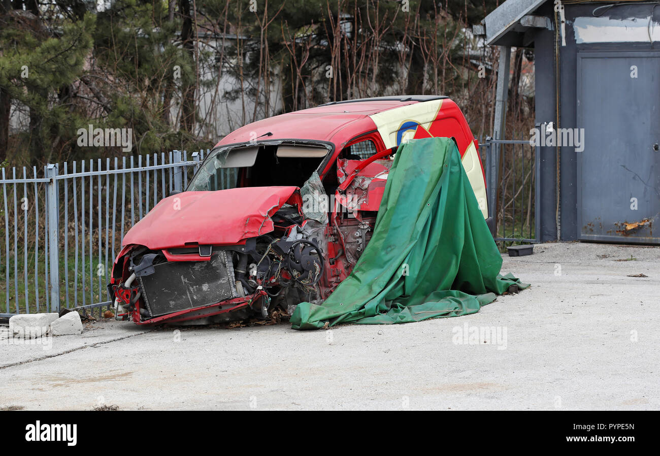 Red van crushed in the back yard Stock Photo - Alamy