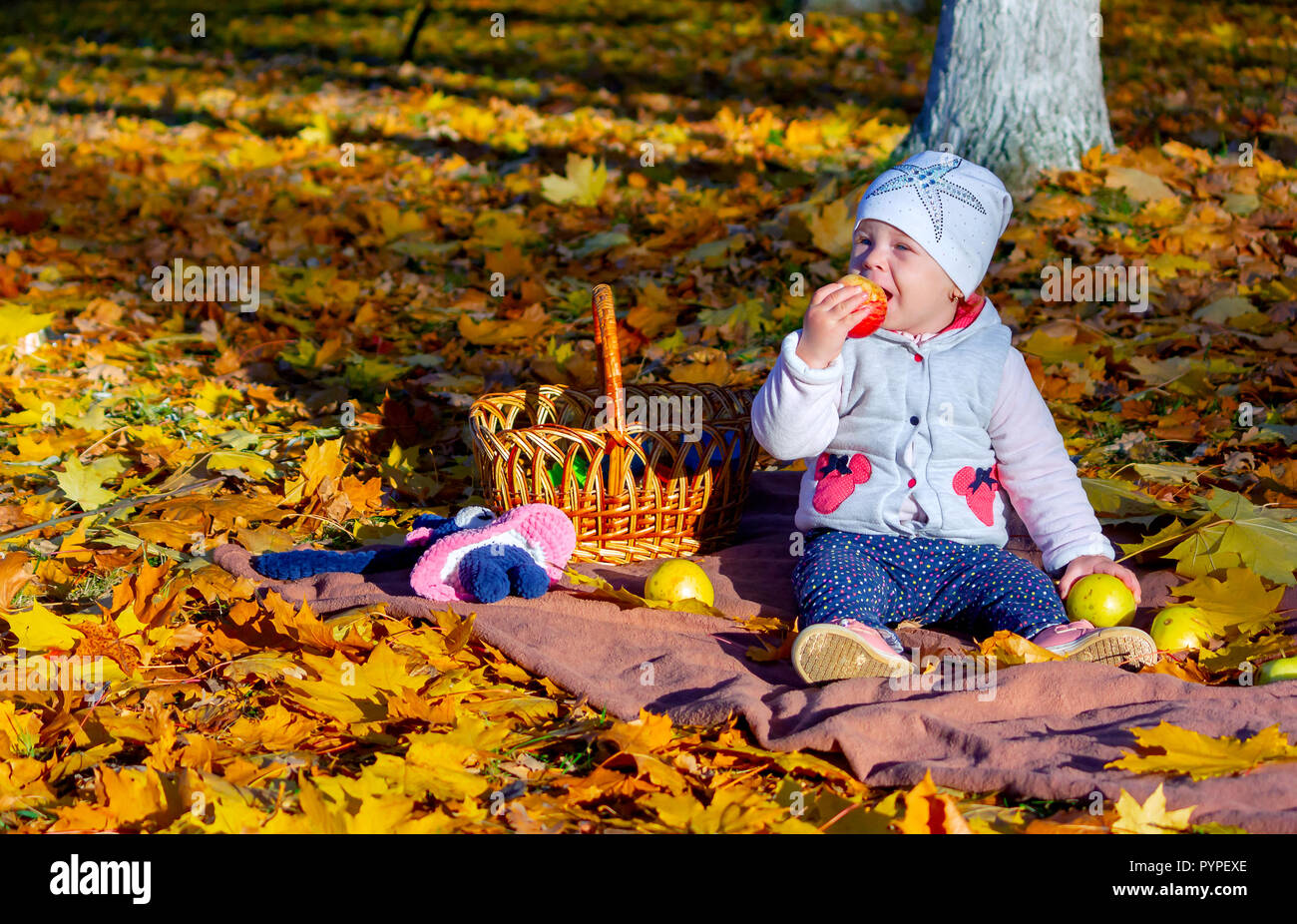 Child girl eating apple outside hi-res stock photography and images - Alamy
