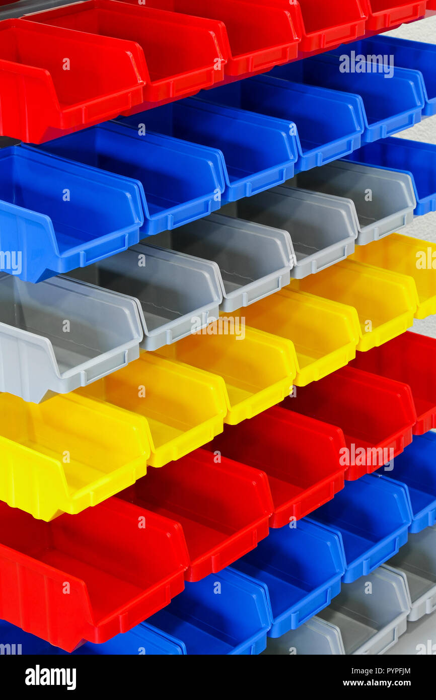 Colourful plastic open box container in warehouse Stock Photo - Alamy