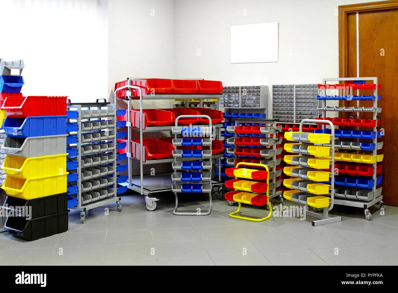 Colorful shelves and racks for warehouse storage Stock Photo - Alamy