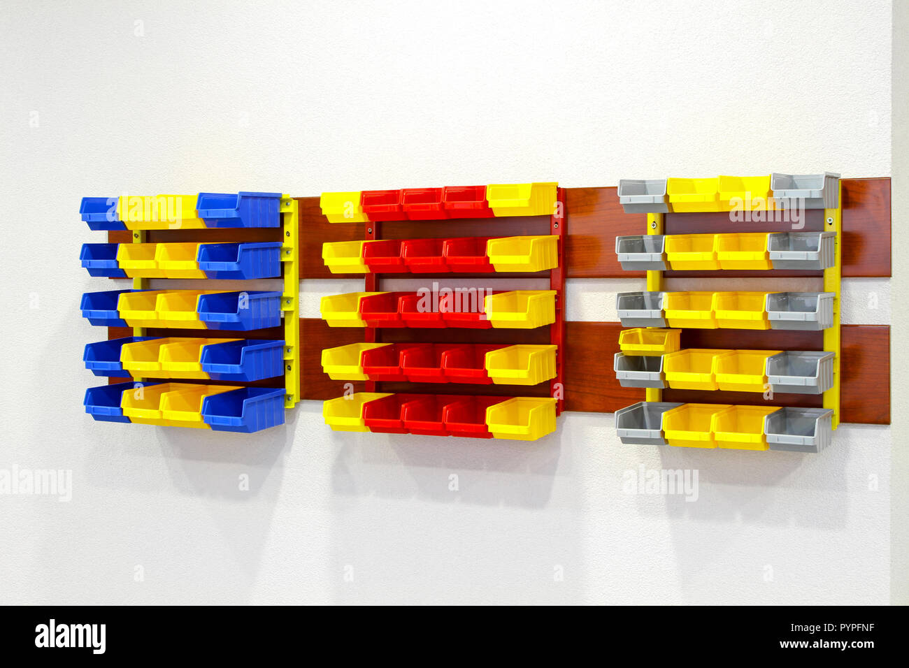 Open plastic boxes wall shelves in storehouse Stock Photo - Alamy