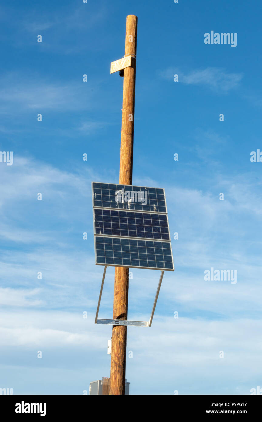 Solar panel on a pole used to power a security camera Stock Photo - Alamy