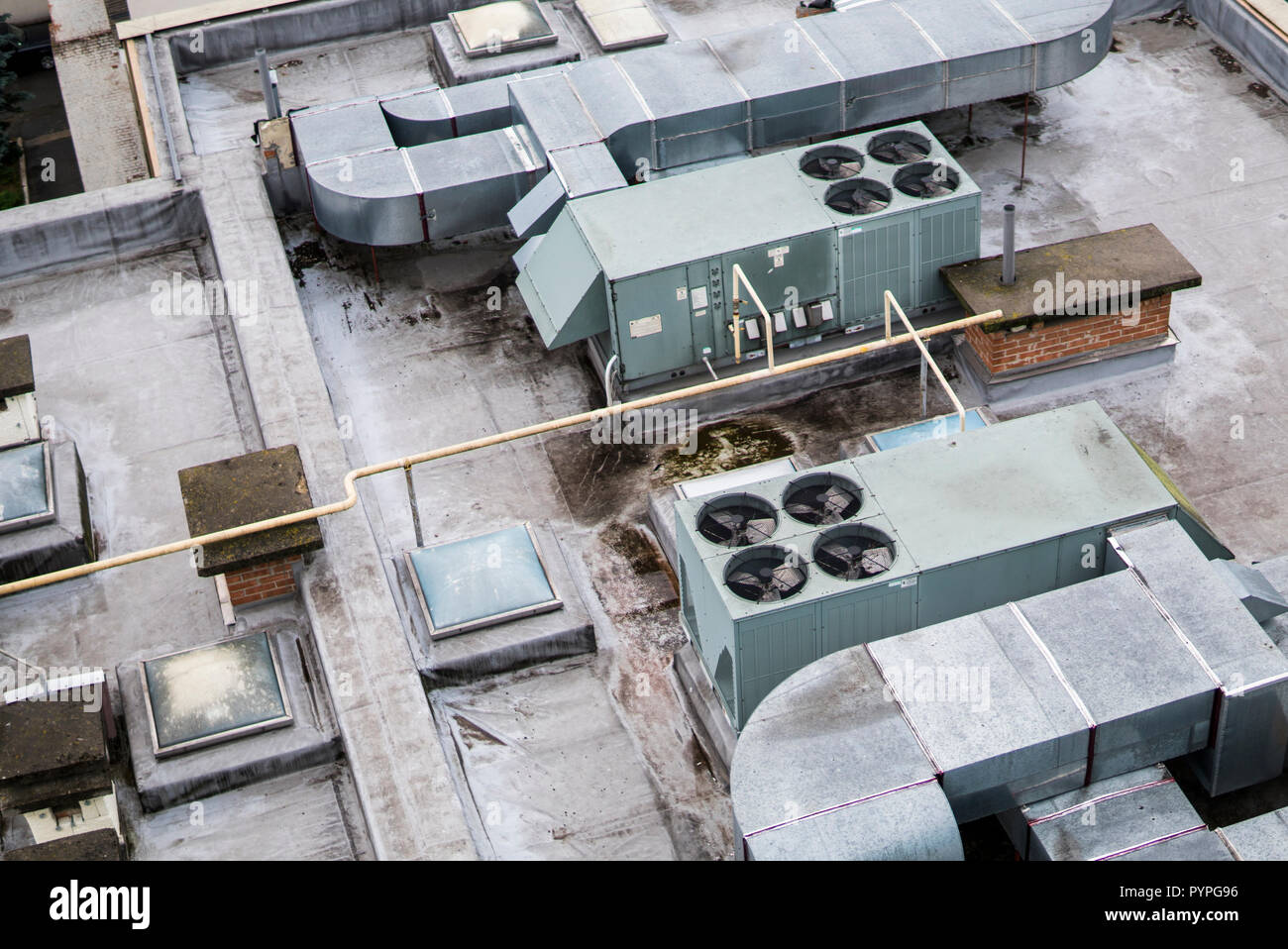 Dirty old roof of a multistory. Ventilation systems on building roof ...