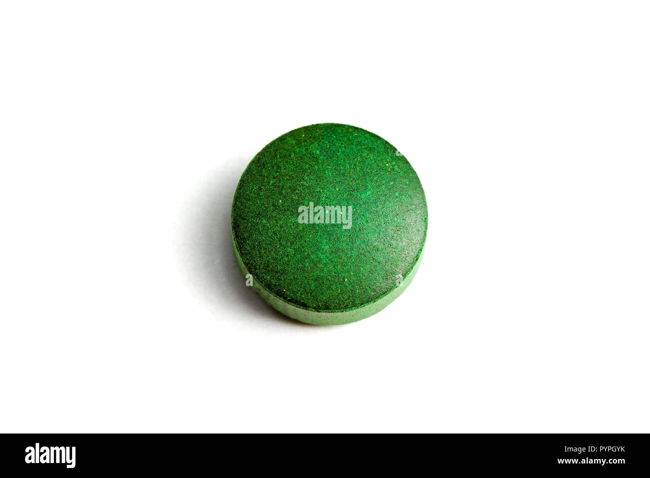 One natural organic green Hawaiian Algae pill Stock Photo - Alamy