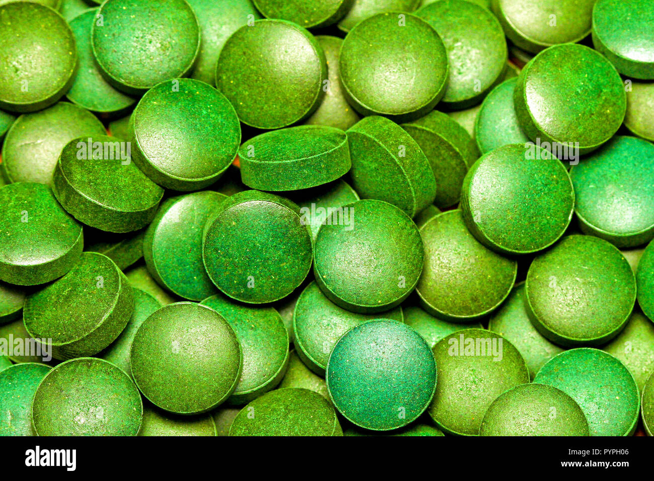 Bunch of natural organic green algae tablets Stock Photo - Alamy
