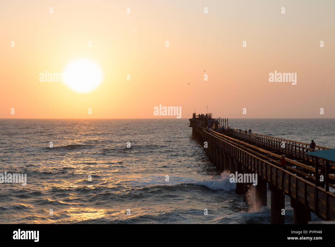 Namibia sunset - the jetty at sunset, on the atlantic coast at ...