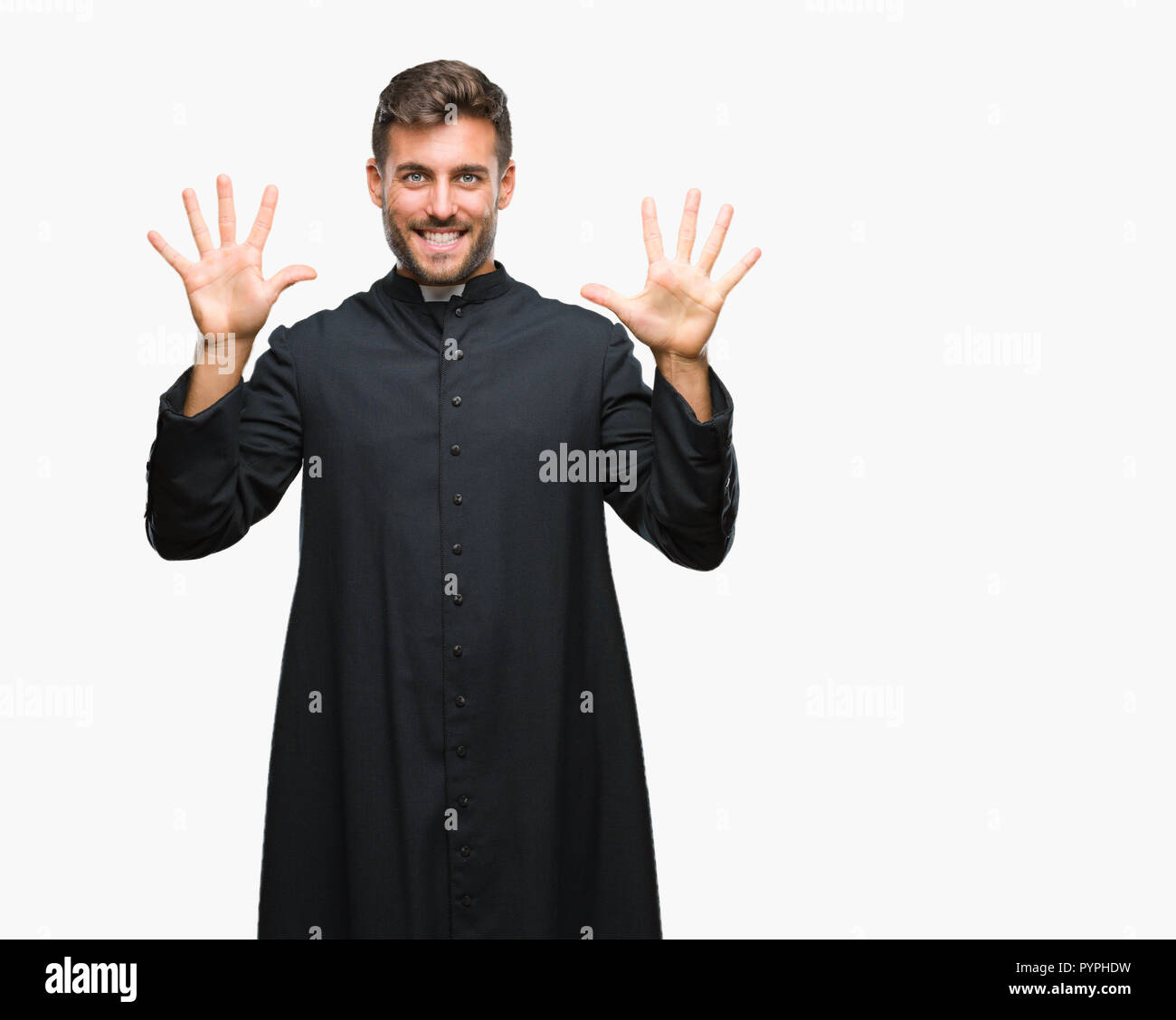 Young catholic christian priest man over isolated background showing ...