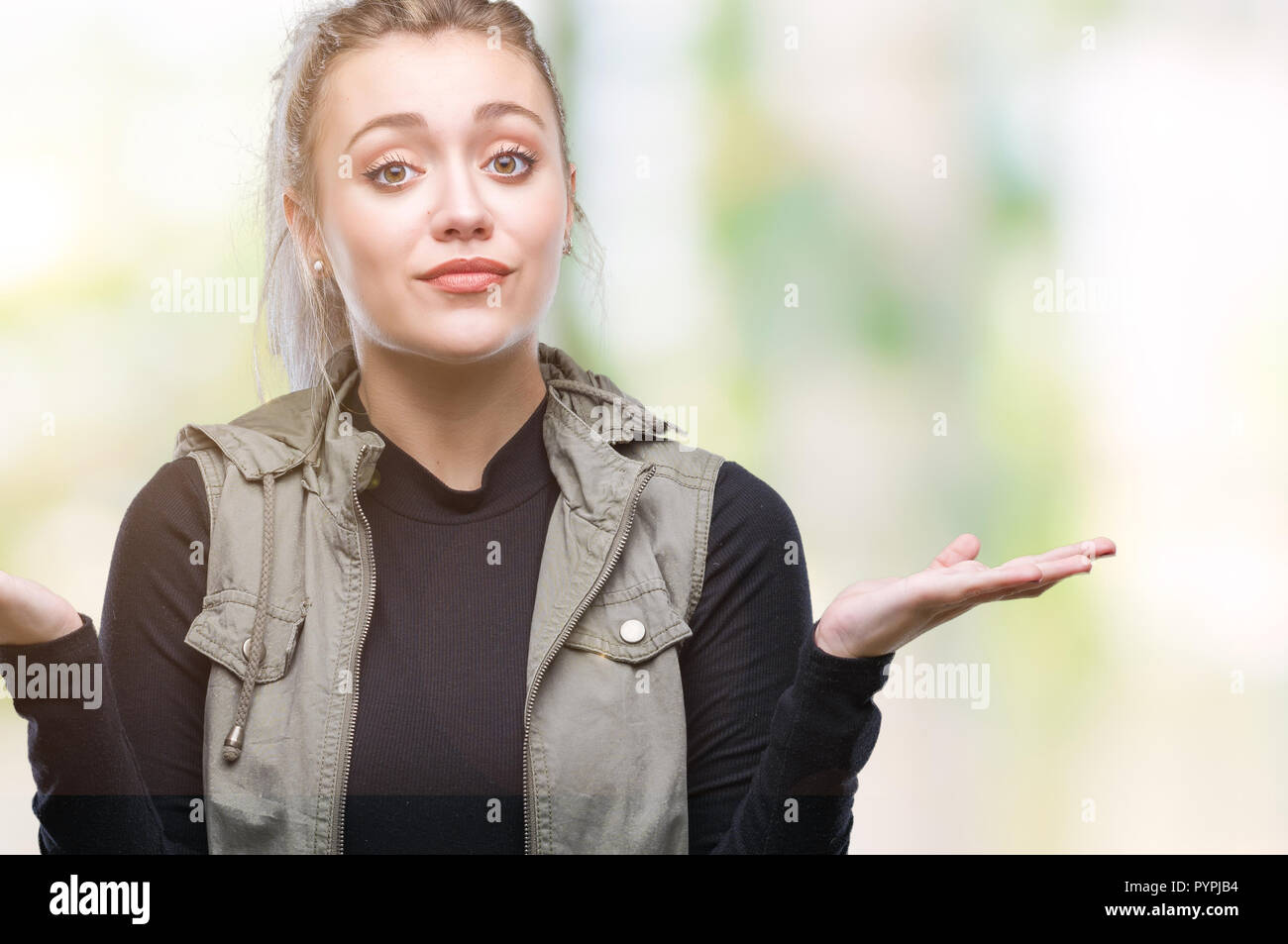 Young blonde woman over isolated background clueless and confused ...