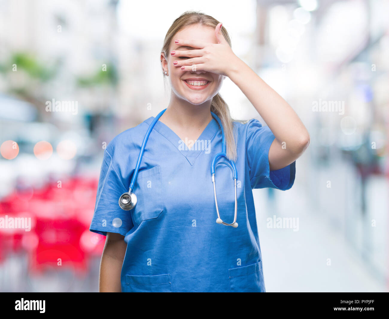 Young blonde surgeon doctor woman over isolated background smiling and ...