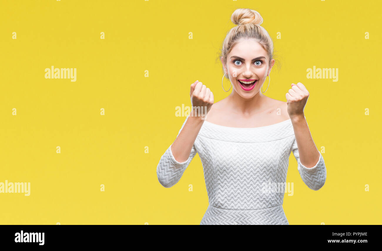 Young beautiful blonde and blue eyes woman over isolated background ...