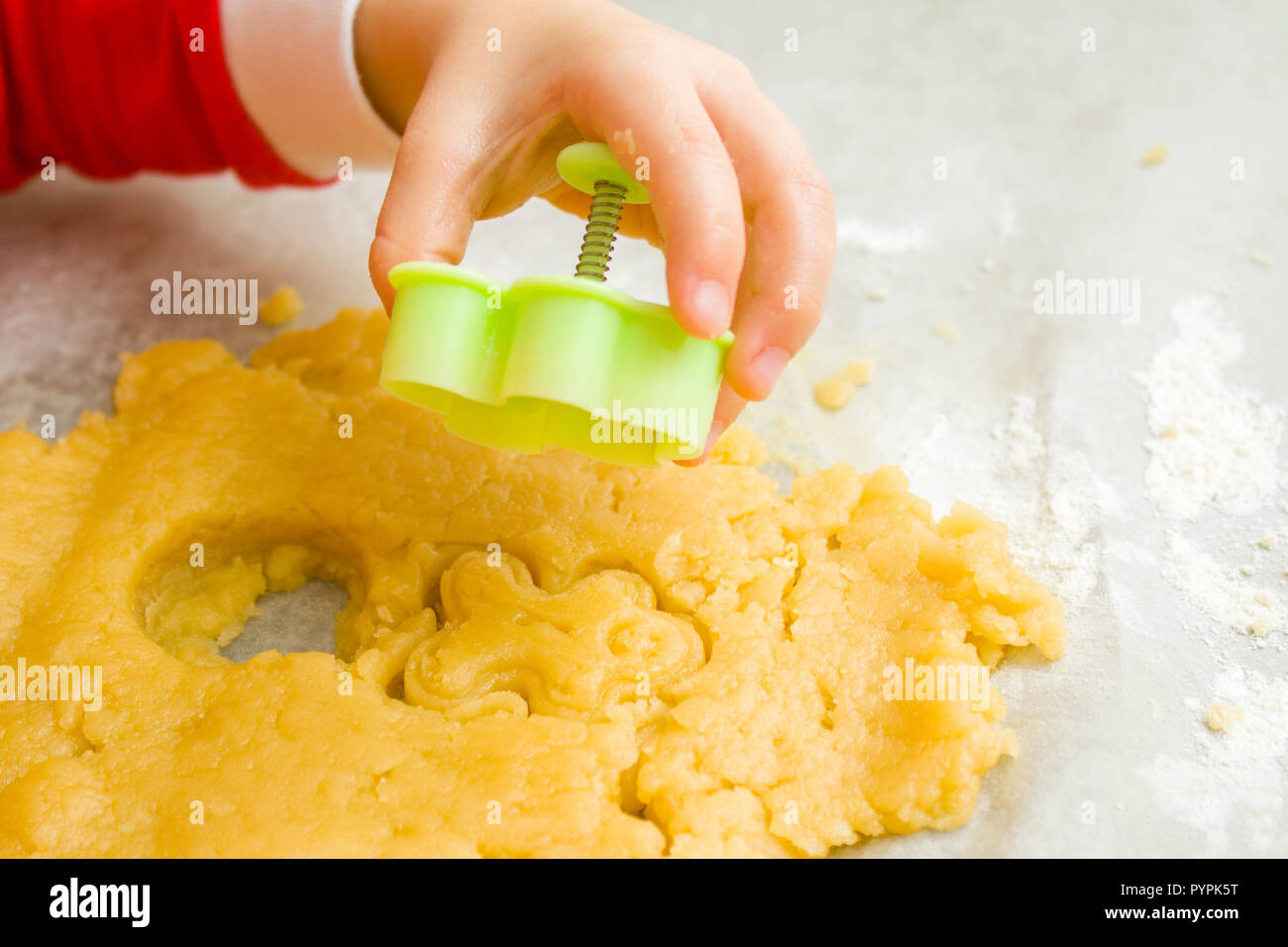 Kids hand with form of christmas cookies for children, making ...
